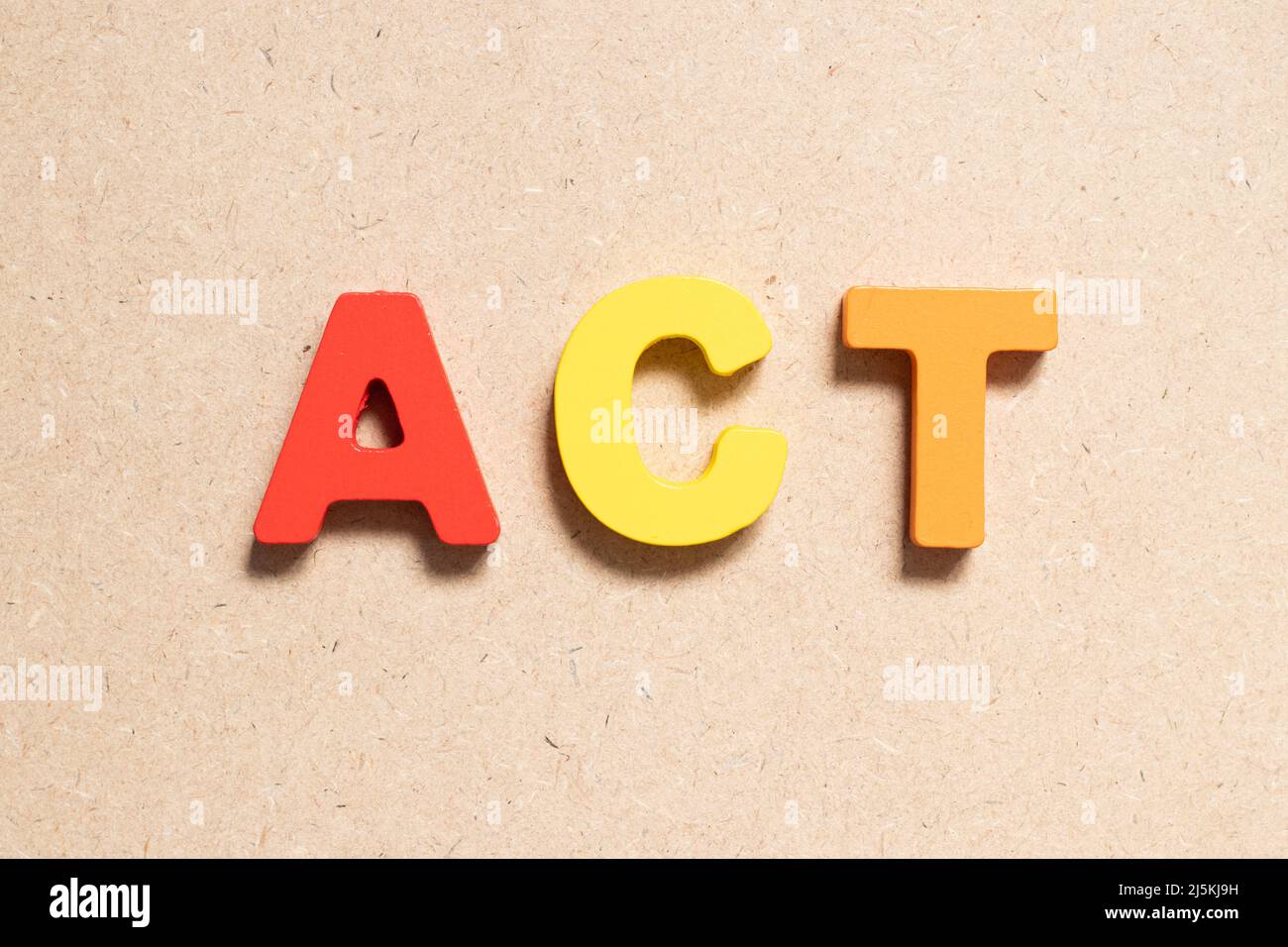 Color alphabet letter in word act on wood background Stock Photo - Alamy