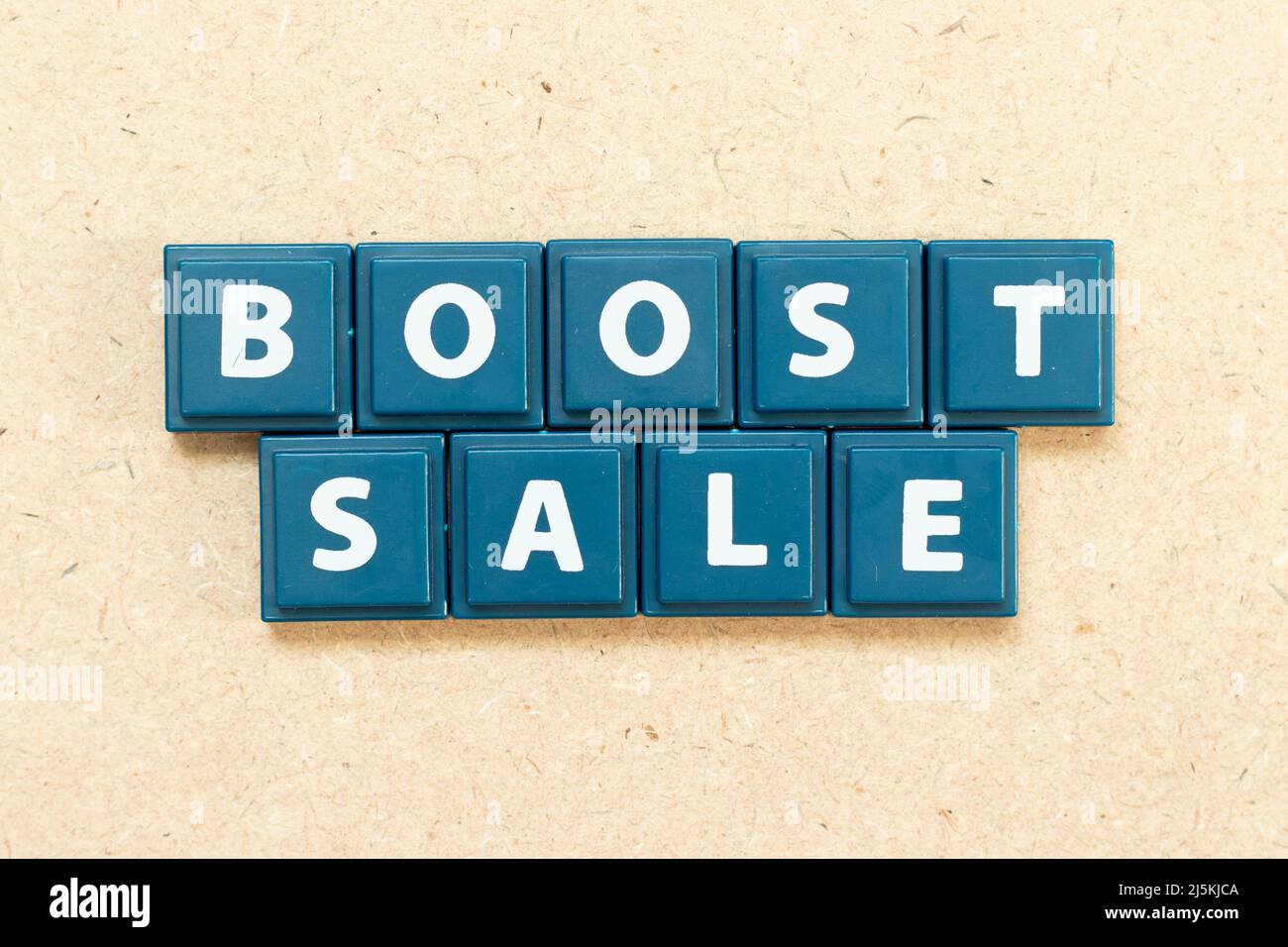 Tile alphabet letter in word boost sale on wood background Stock Photo ...