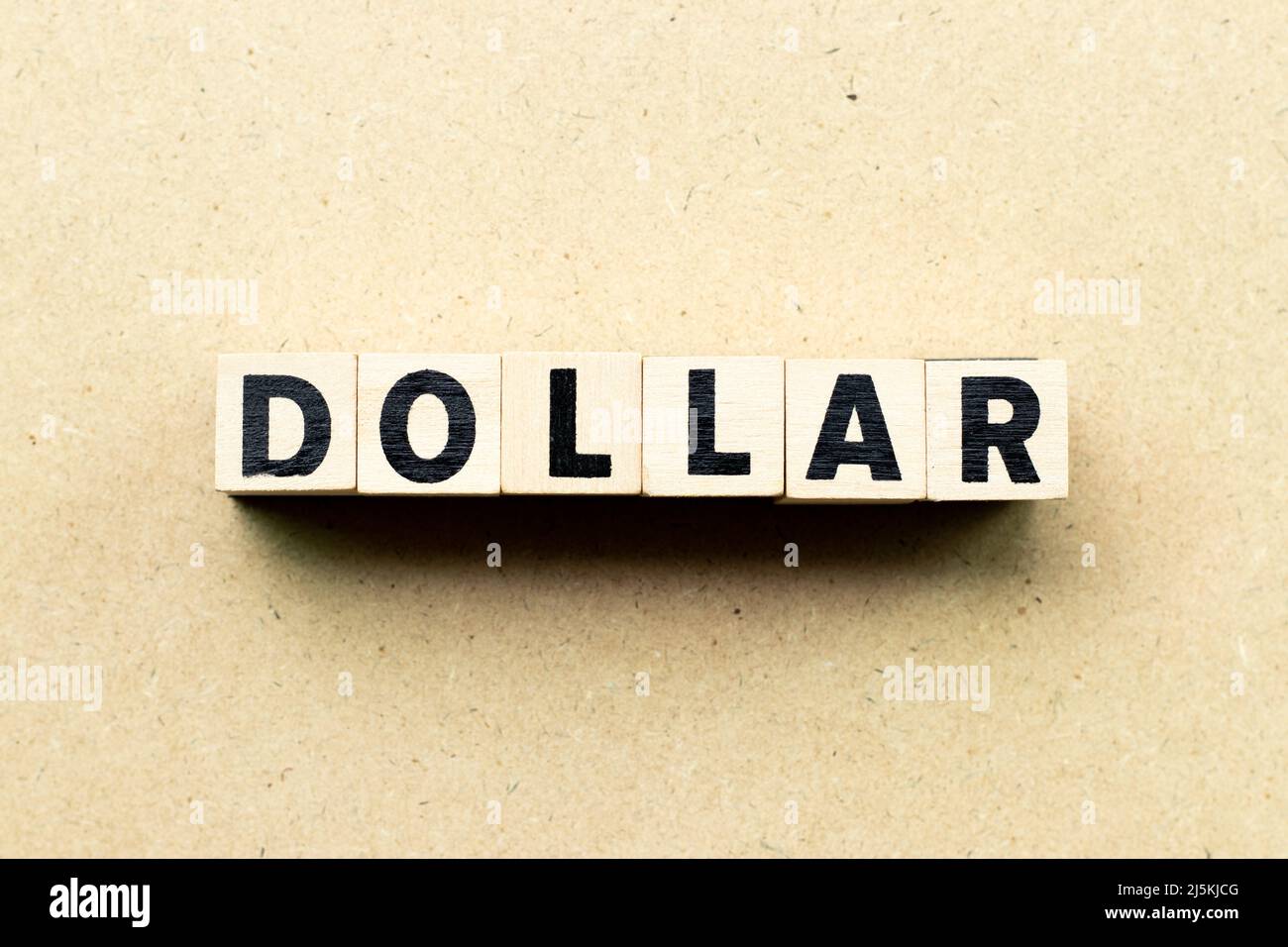 Alphabet letter block in word dollar on wood background Stock Photo - Alamy