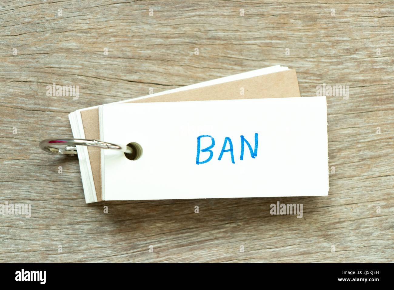 Flash card with handwriting word ban on wood background Stock Photo - Alamy