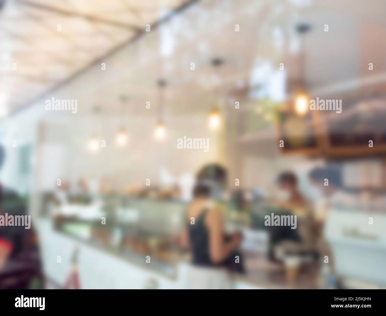 Abstract blurred background inside the coffee shop and the counter bar ...