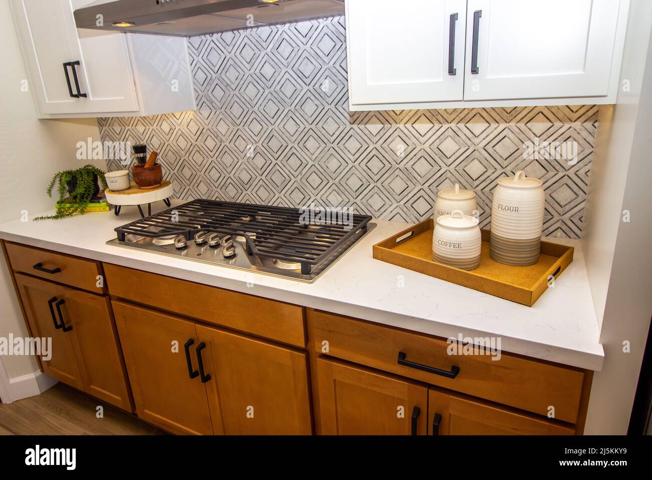 Modern Kitchen Counter With Gas Cook Top And Decorator Items Stock ...