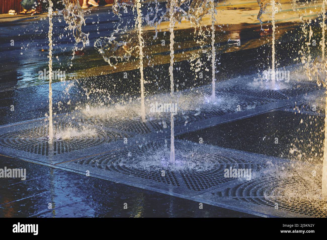 Cool water fountains flow in the summer heat Stock Photo - Alamy