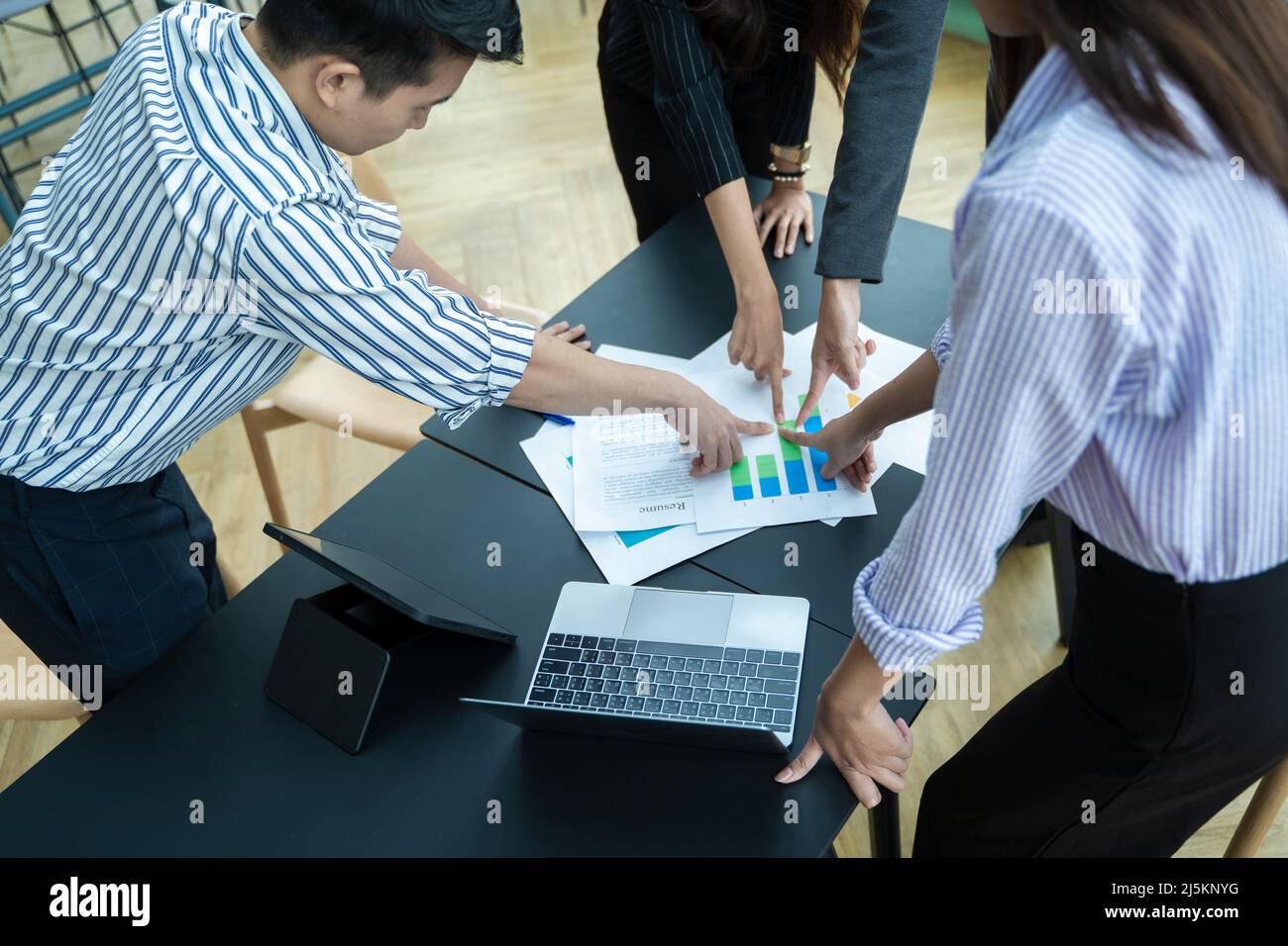 Group of Asia young business people working and communicating while ...