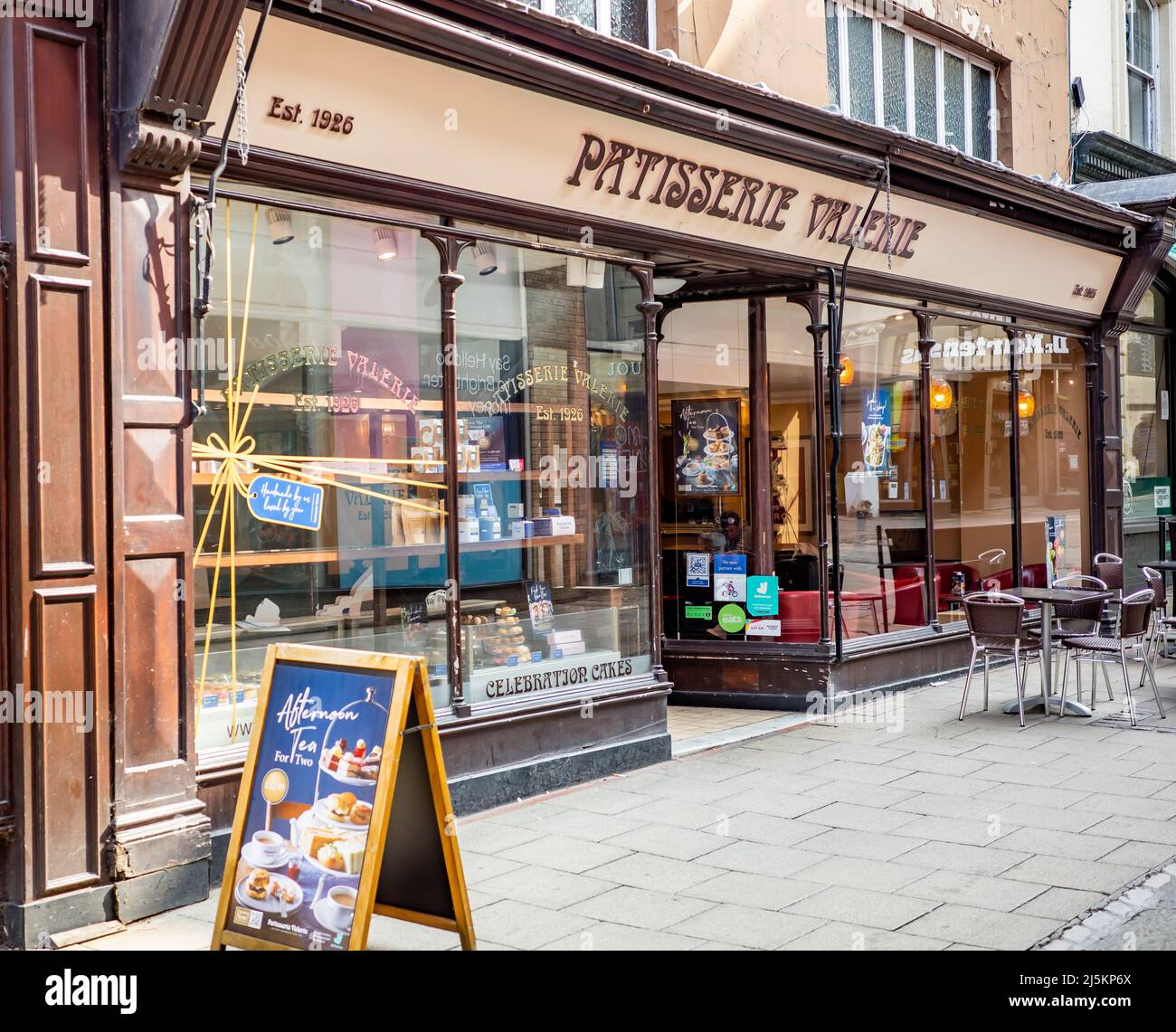 Norwich, Norfolk, UK – April 24 2022. Menu board and outdoor seating on ...