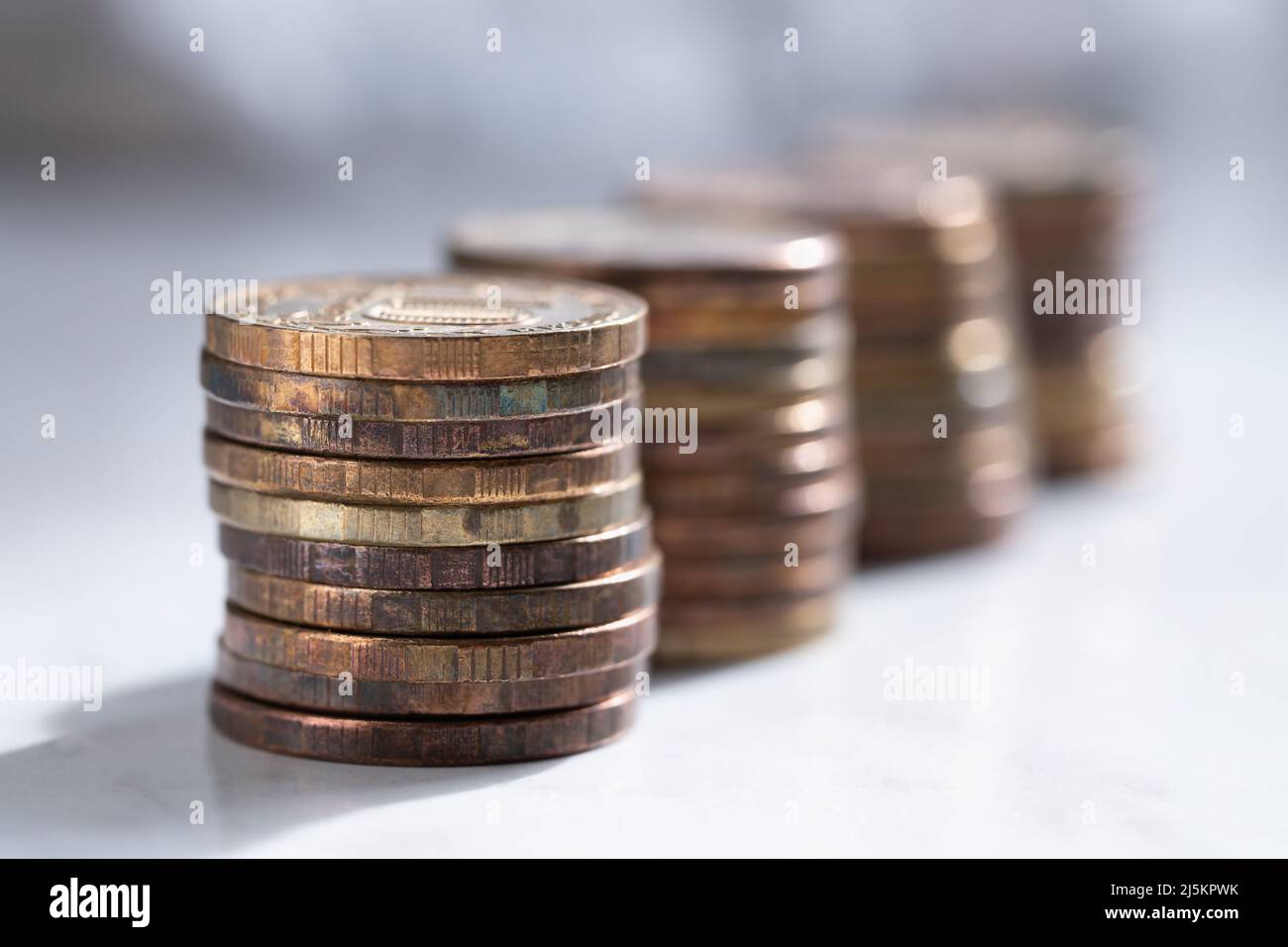 Coin stacks on a white background hi-res stock photography and images ...