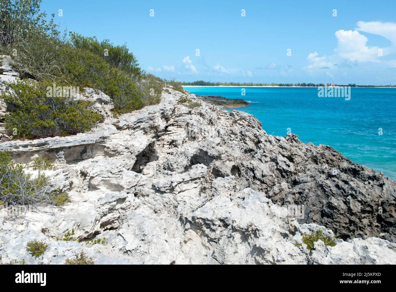 The scenic view of sharp rocky coastline and a beach in a background on ...