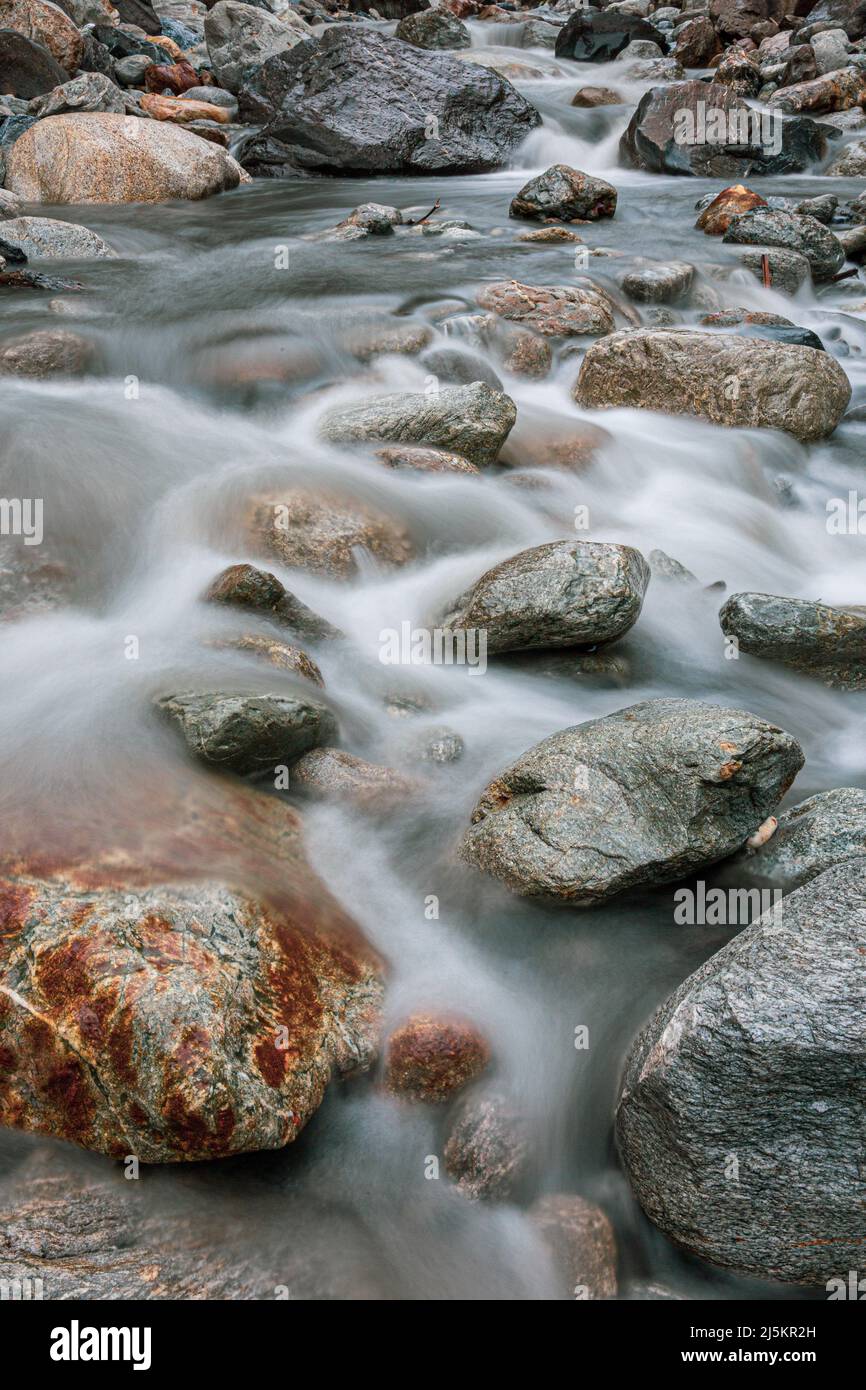 Ice-cold water flows through the valley of Grindelwald Stock Photo - Alamy