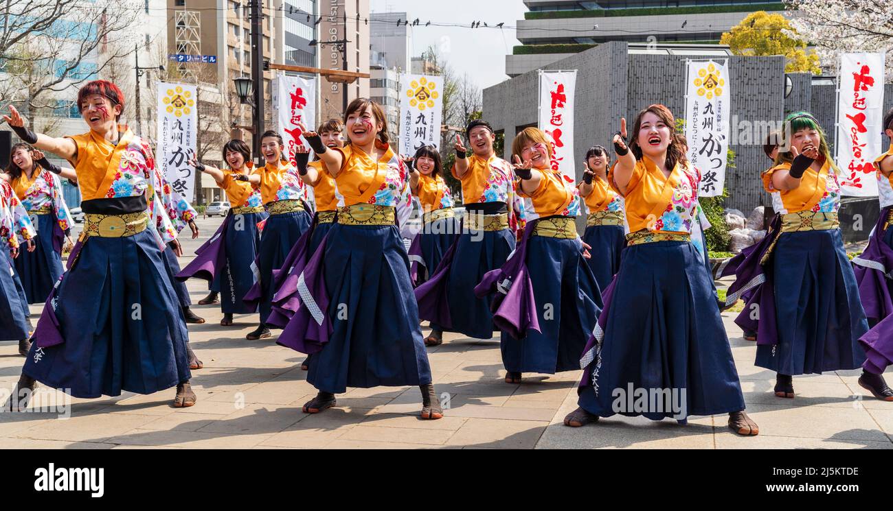 Japanese team of Yosakoi dancers dancing in colourful yukata tunics ...