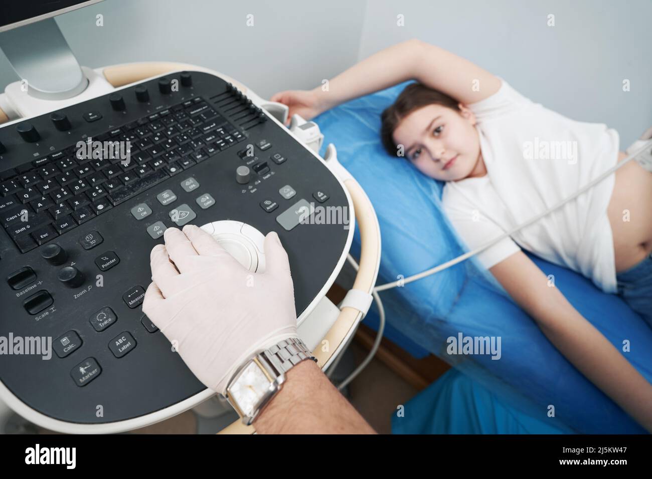 Young girl undergoing a kidney check up in an ultrasound room Stock ...