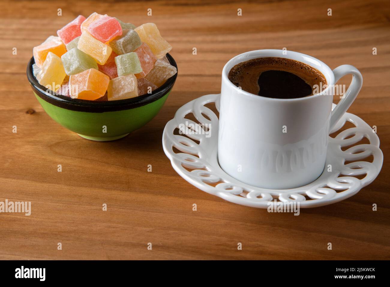 Traditional Turkish delight and Turkish coffee on a wooden background ...
