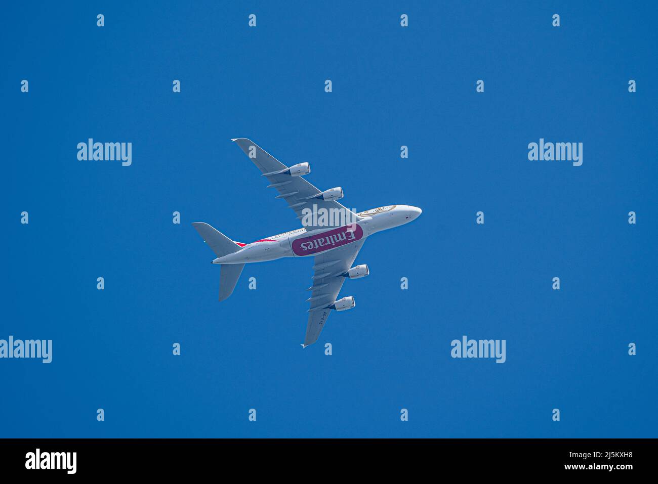 24 April 2022: Underside view of Emirates airline Airbus airplane in ...