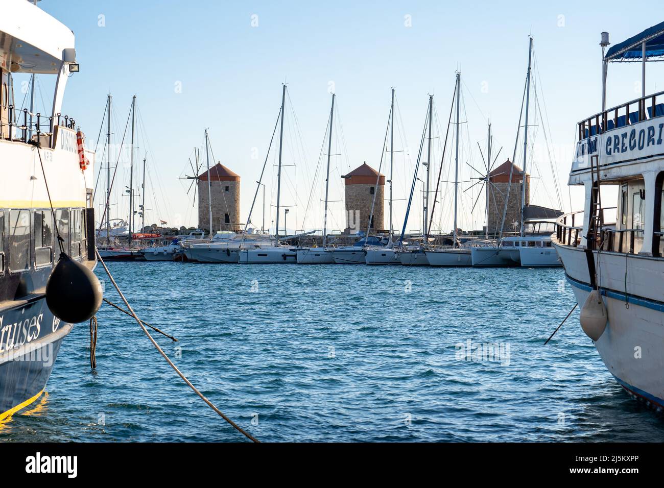 Rhodes Windmills view from the side of the Mandraki Marina and Port ...