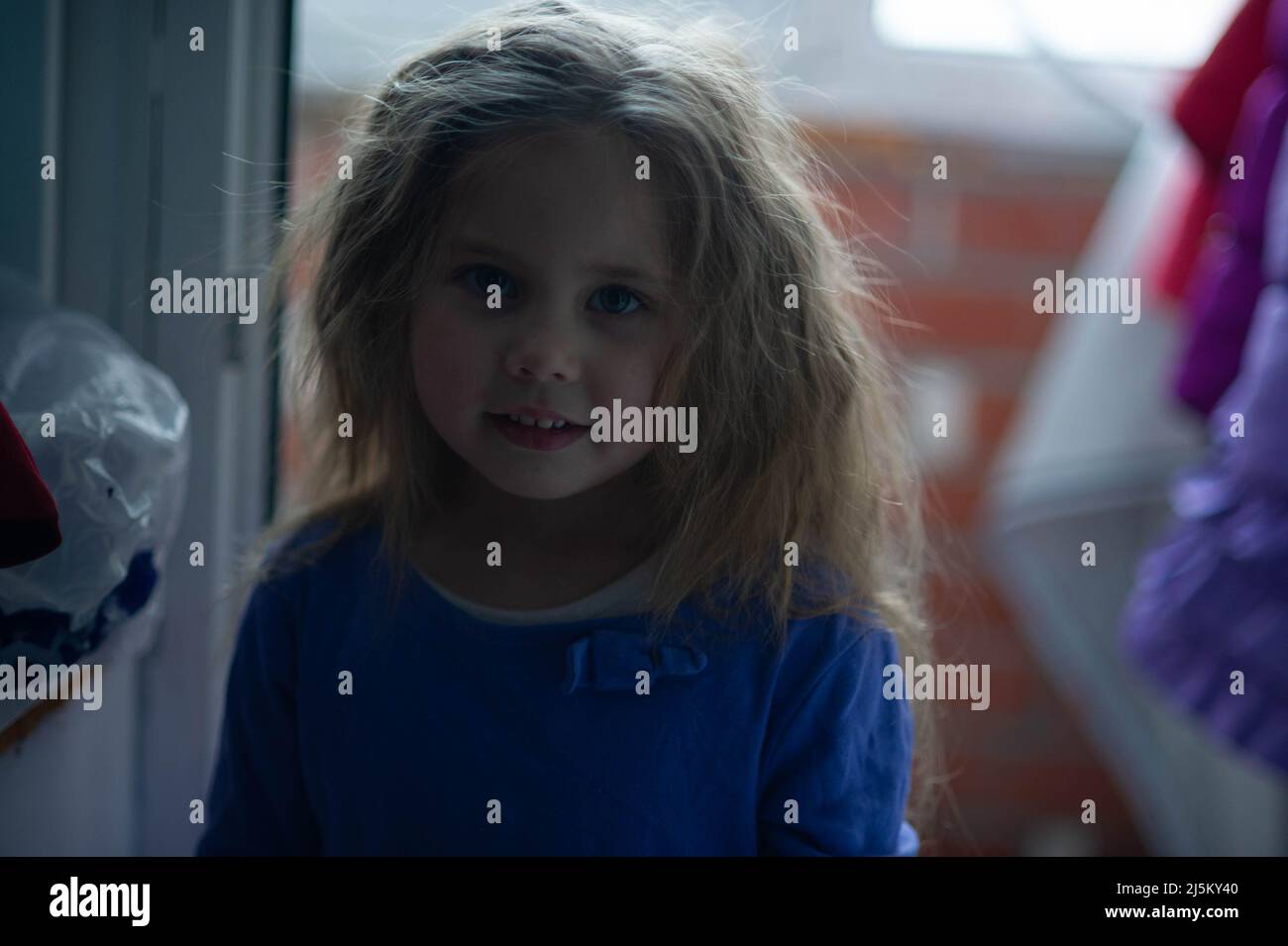 Adorable little girl against the large window Stock Photo - Alamy