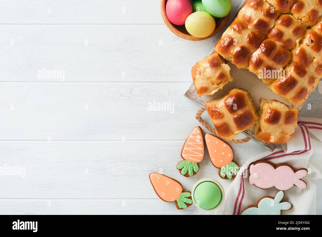 Easter hot cross buns with colored eggs, Easter gingerbread rabbits and ...