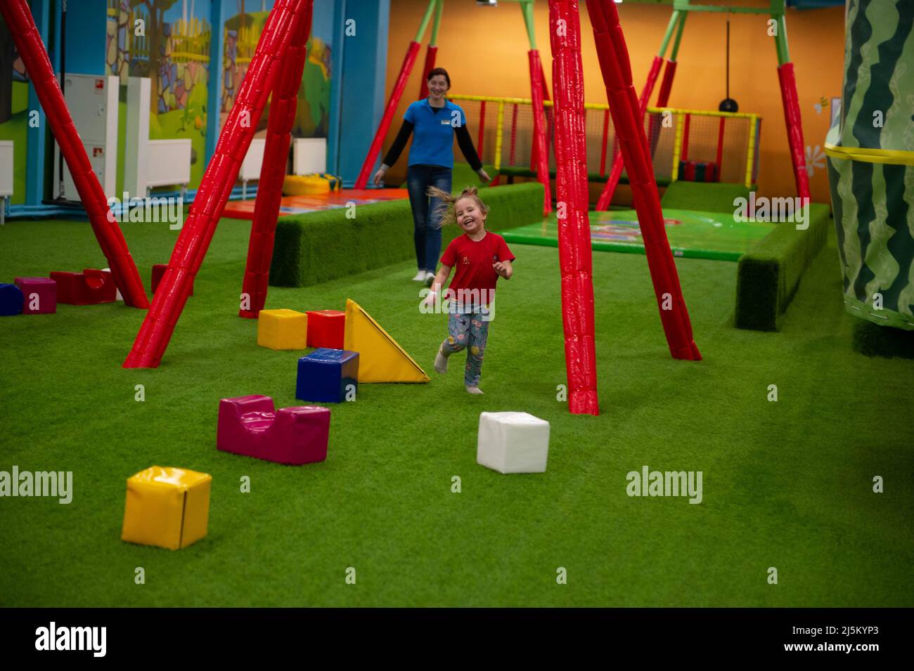 Children play a variety of games in fun room Stock Photo - Alamy