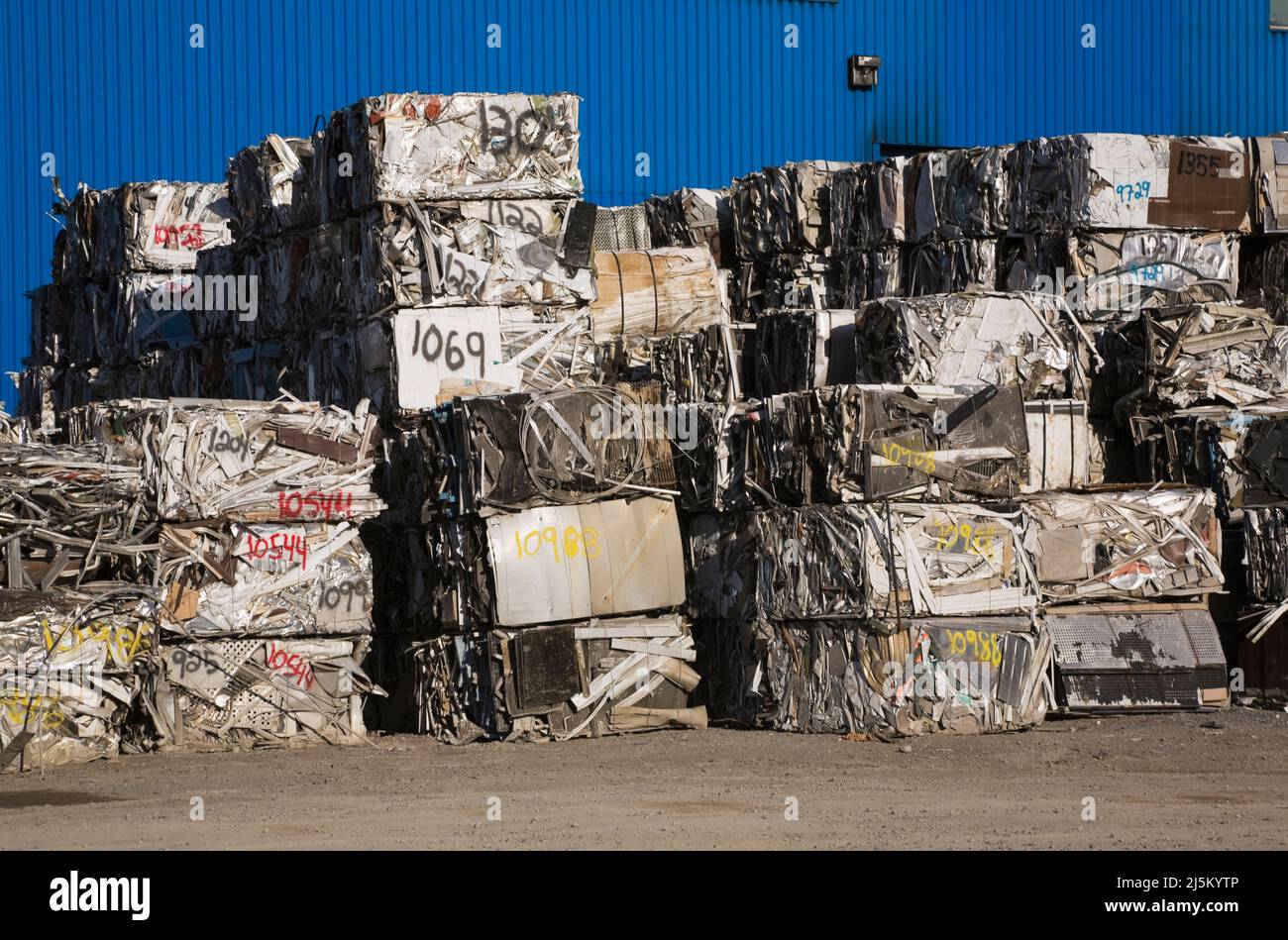 Bales of crushed and compacted pieces of various metals at a recycling ...