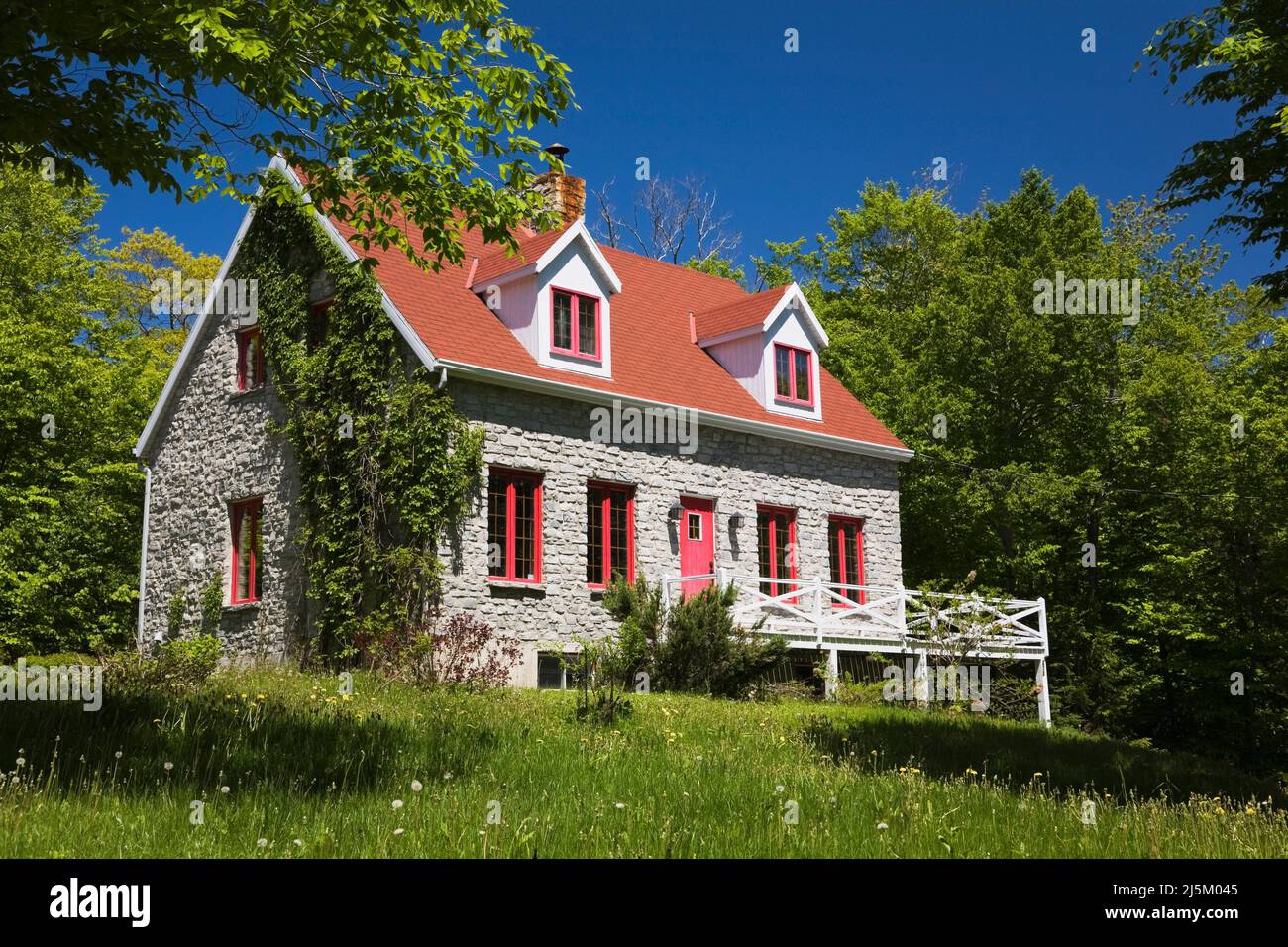Old Canadiana cottage style home at spring time, Saint-Petronile, Ile-d ...