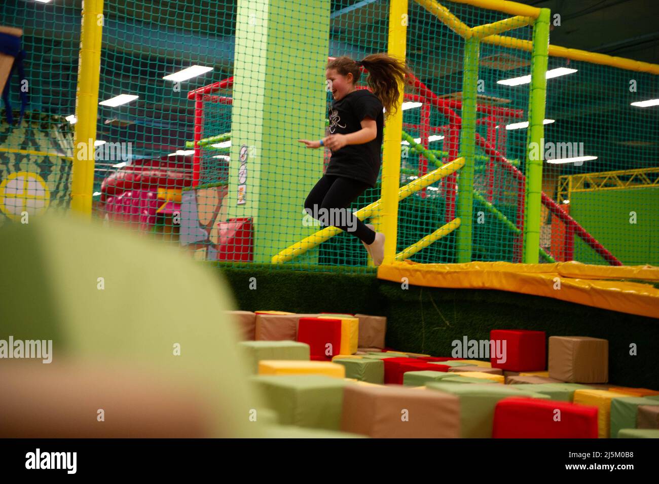 Children play a variety of games in fun room Stock Photo - Alamy