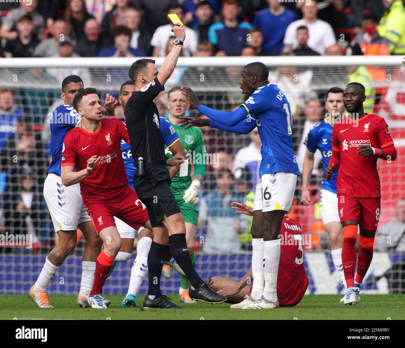 Referee stuart attwell shows a yellow card hi-res stock photography and ...