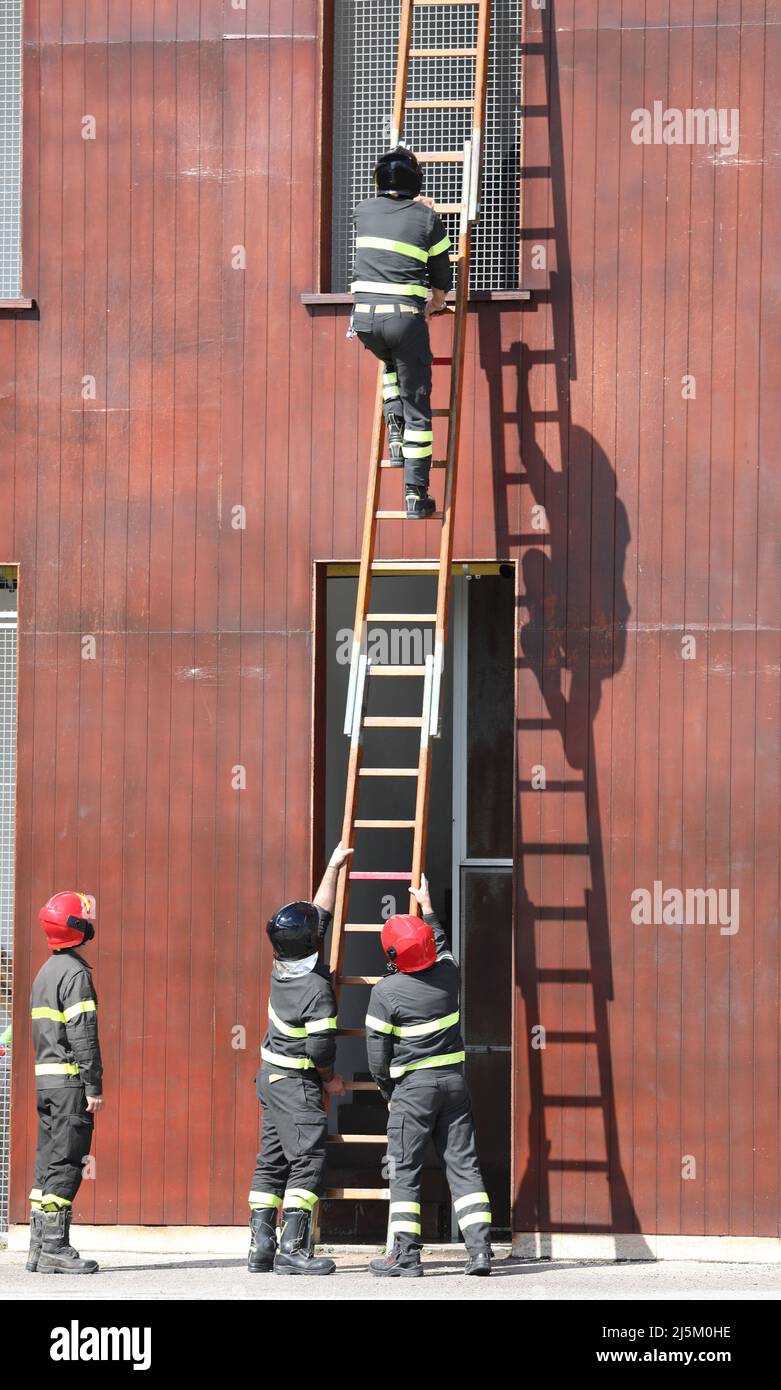 firefighters in action during the exercise in the fire station with the ...