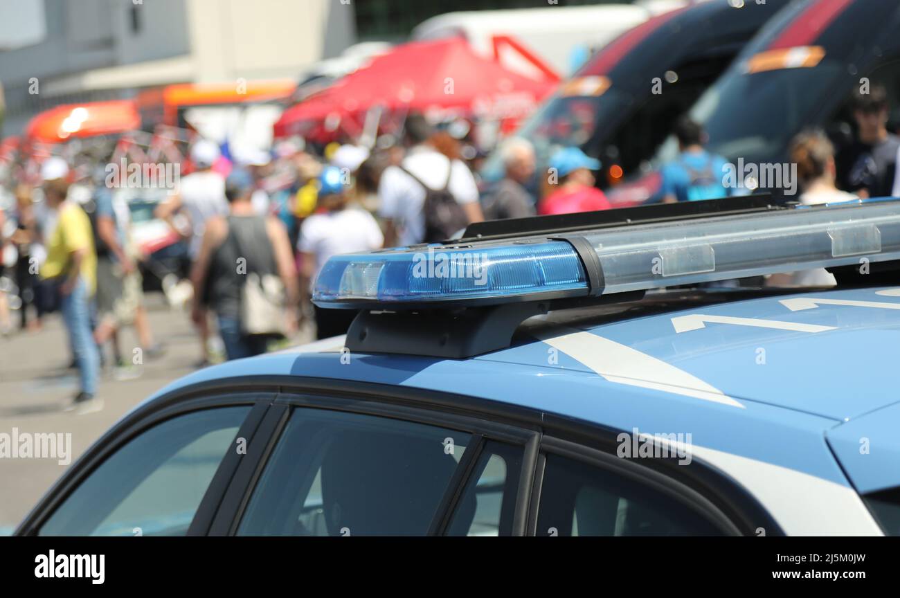 police car with flashing lights on it during the escort and ...