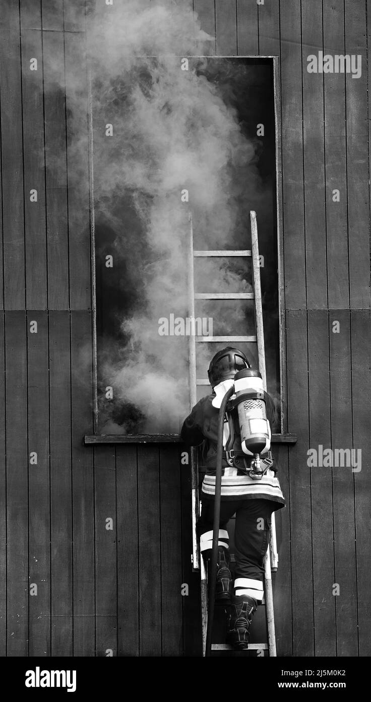 firefighter in action in the fire station with self-contained breathing ...