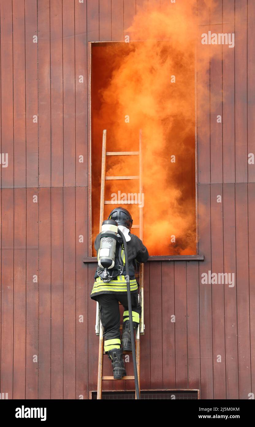 firefighter in action in the fire station with self-contained breathing ...