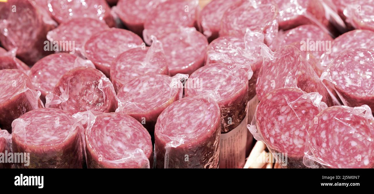 many salami and sausages made with pork and wild boar for sale in the ...