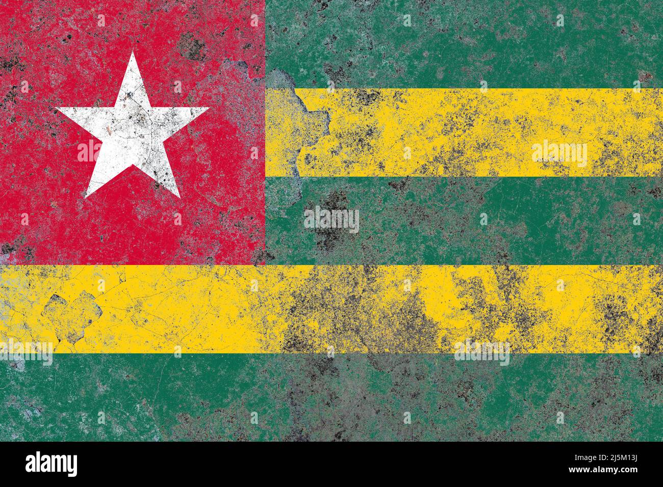 Togo flag on a damaged old concrete wall surface Stock Photo - Alamy