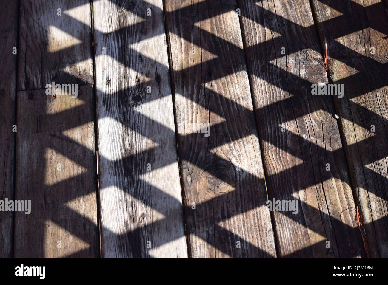 Shadow cast by wood lattice on a wooden deck Stock Photo - Alamy