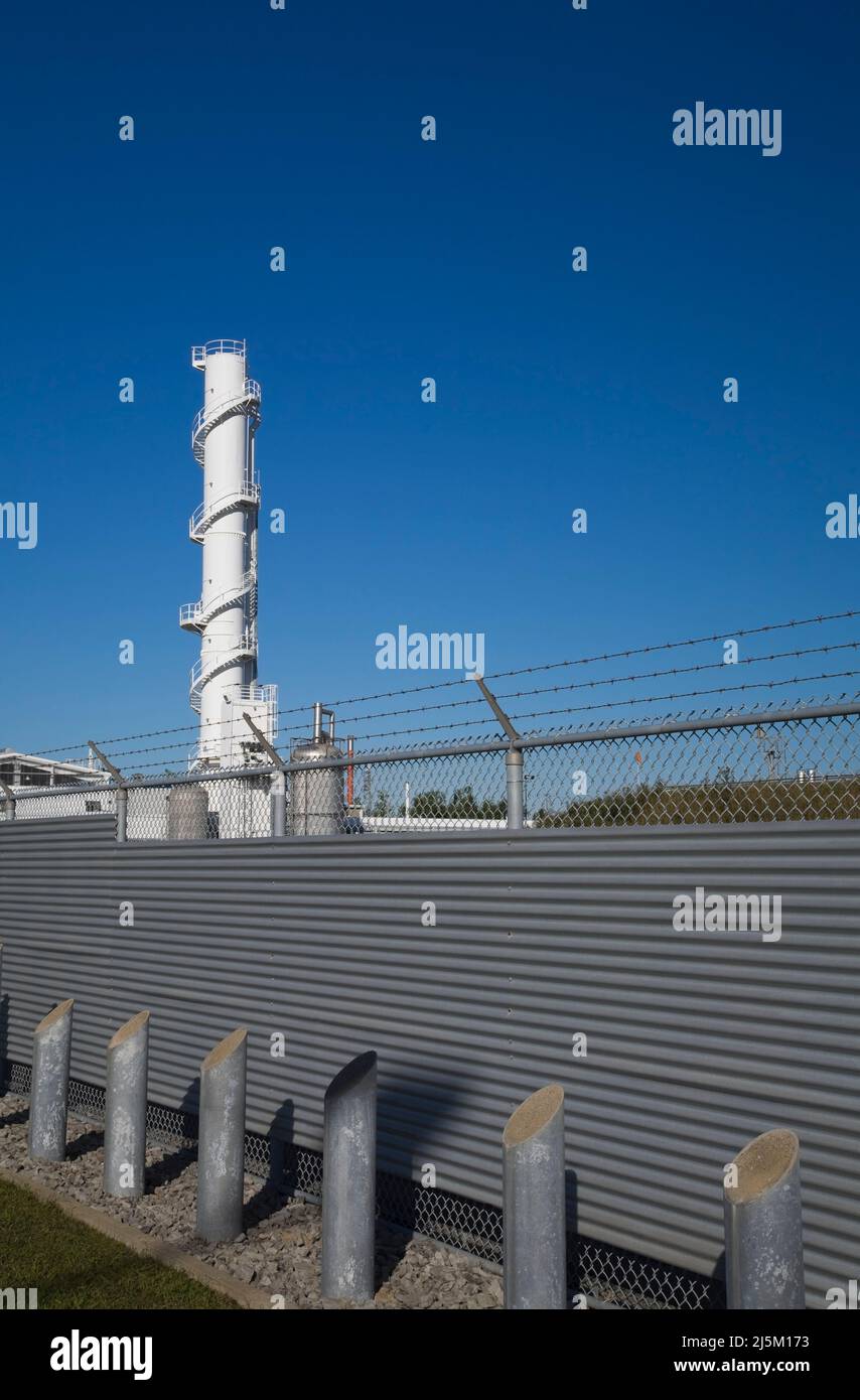 Natural gas refining facility beyond a security fence, Montreal East ...
