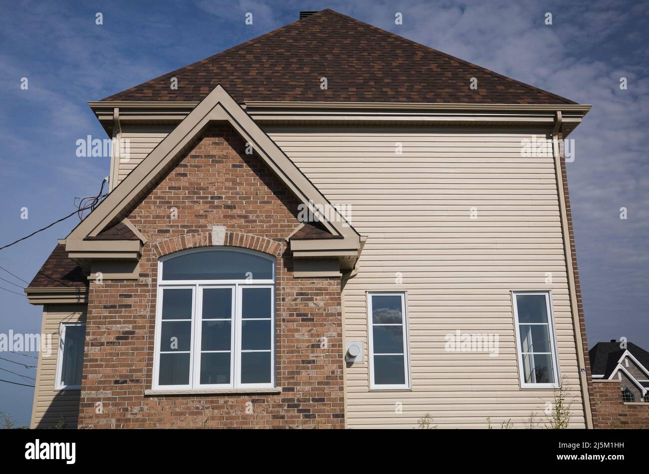 Residential cottage style model home in a new housing development Stock ...