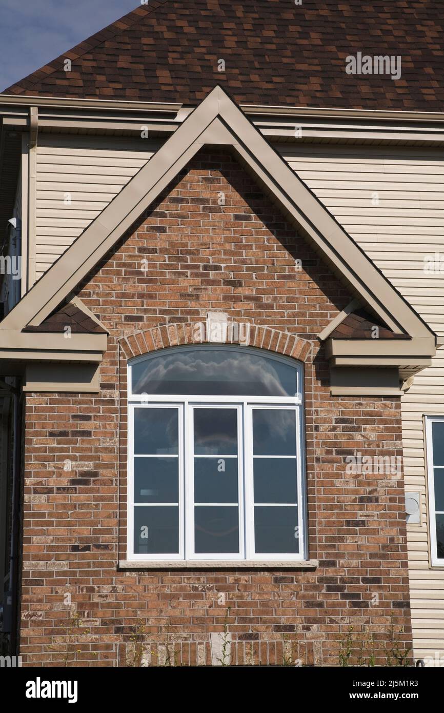 Residential cottage style model home in a new housing development Stock ...