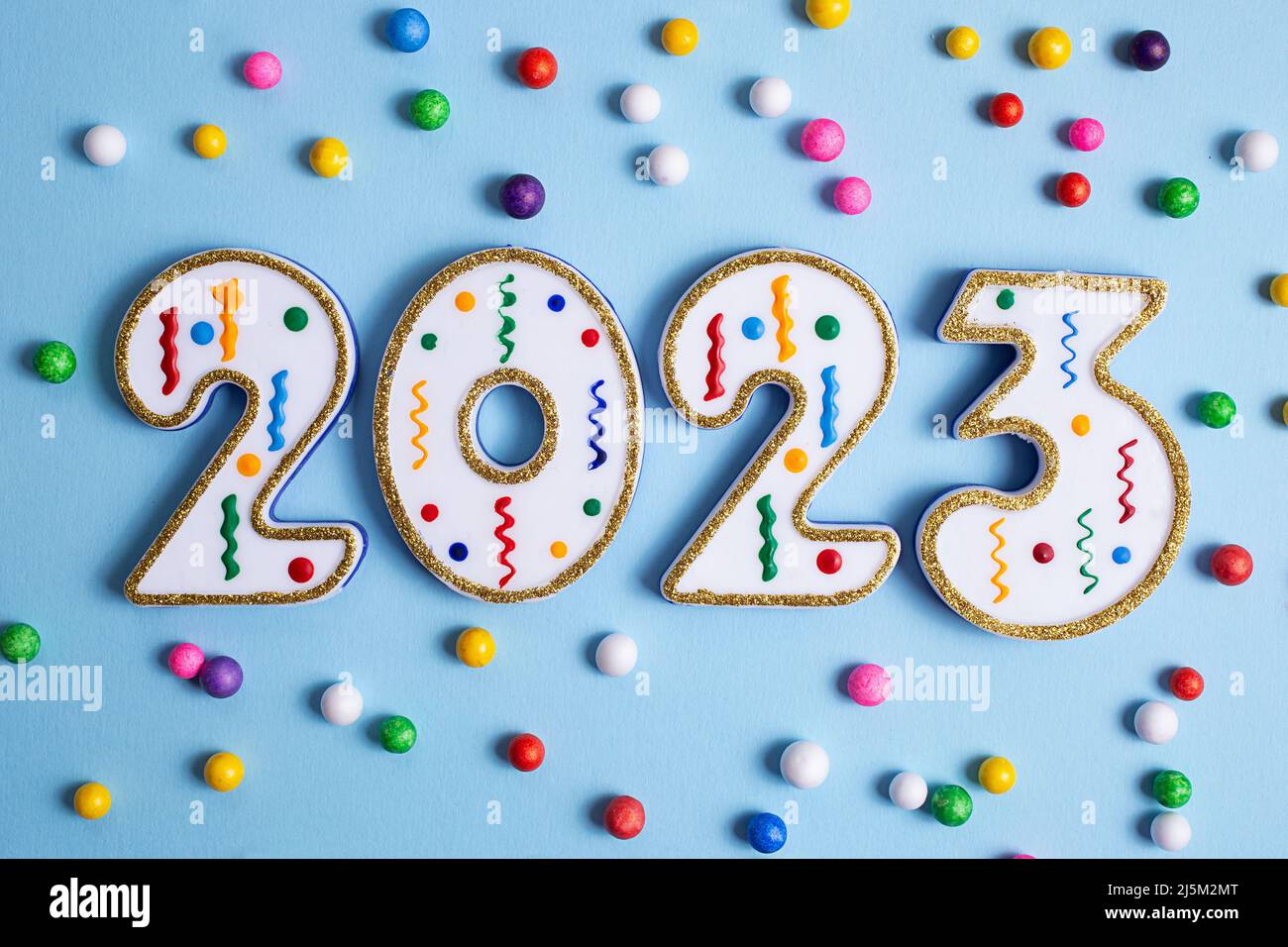 Multicolored numbers 2023 on the blue background.Bright decorative ...