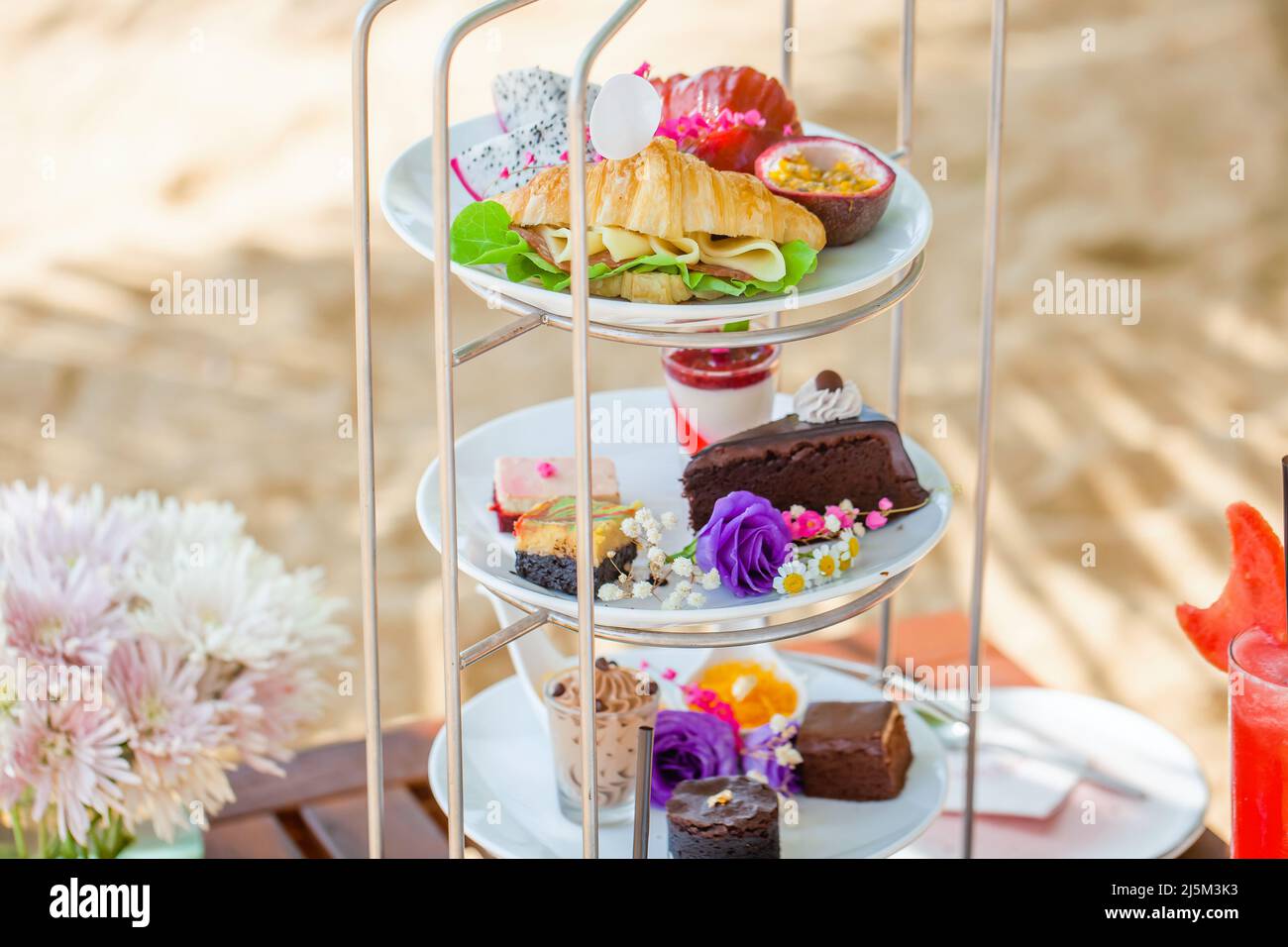 Afternoon tea on tropical sandy beach with shadows from palm trees in ...