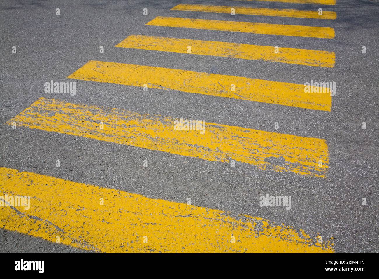 Yellow striped crosswalk Stock Photo - Alamy