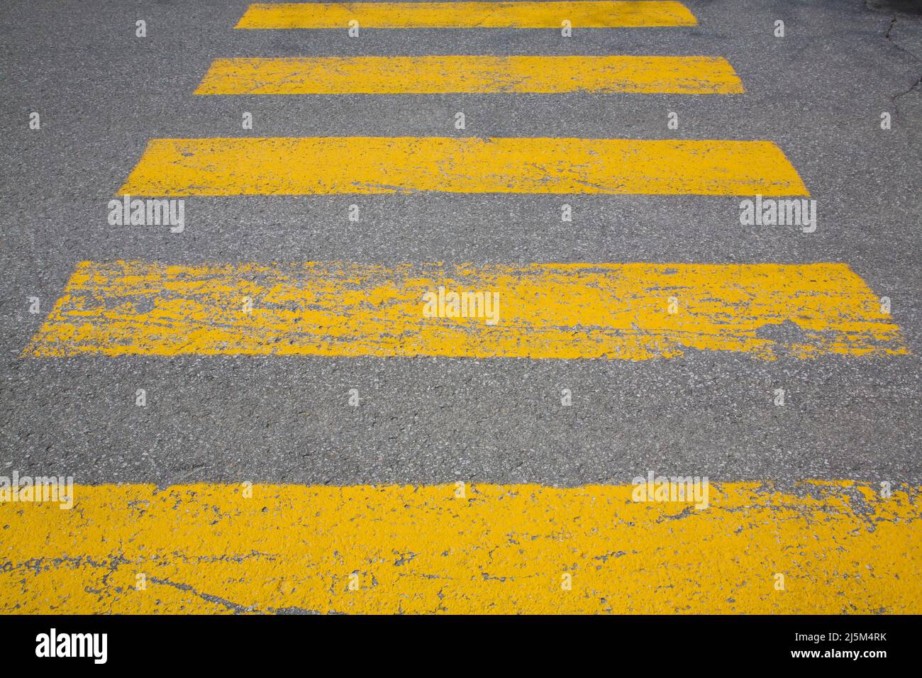 Yellow striped crosswalk Stock Photo - Alamy