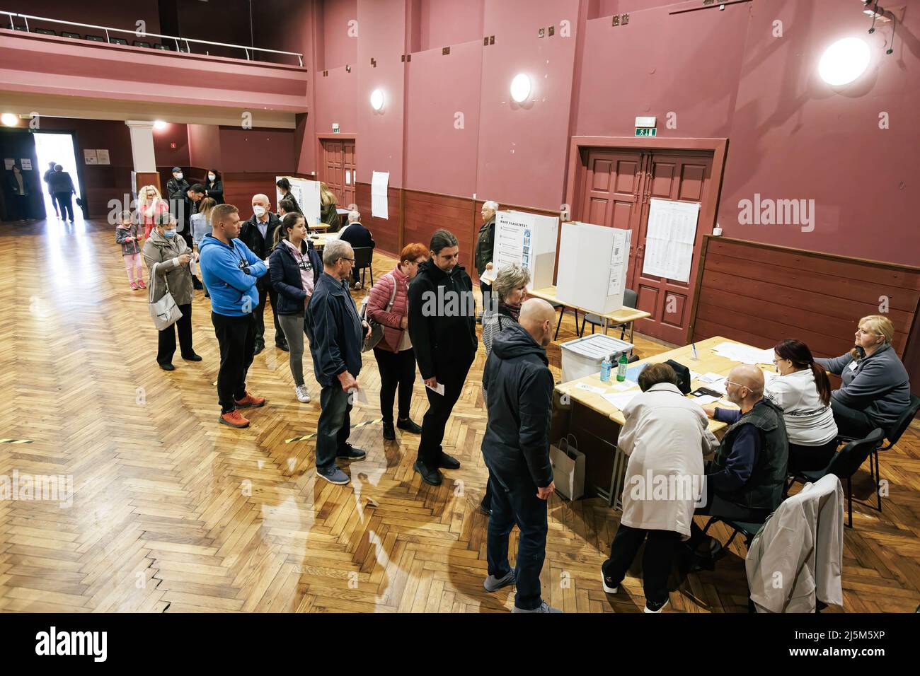 People vote at a polling station during the 2022 Slovenian ...