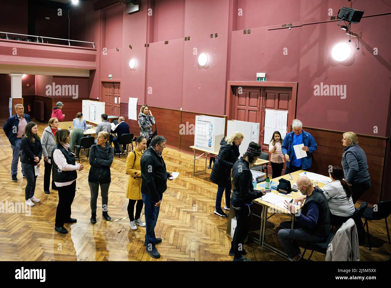 People vote at a polling station during the 2022 Slovenian ...