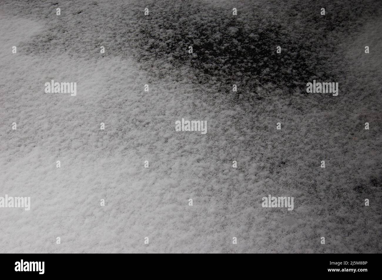 Winter background: black ground covered with white snow Stock Photo - Alamy