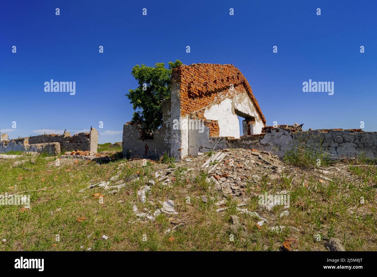 A brick one-story residential old building destroyed by an explosion ...