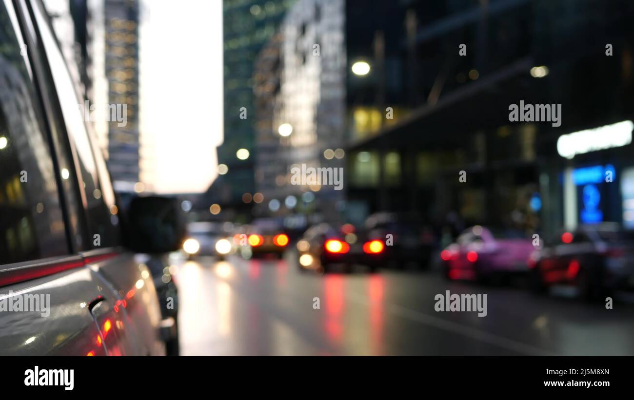 Defocused cars lights on road in twilight, vehicles traffic on ...