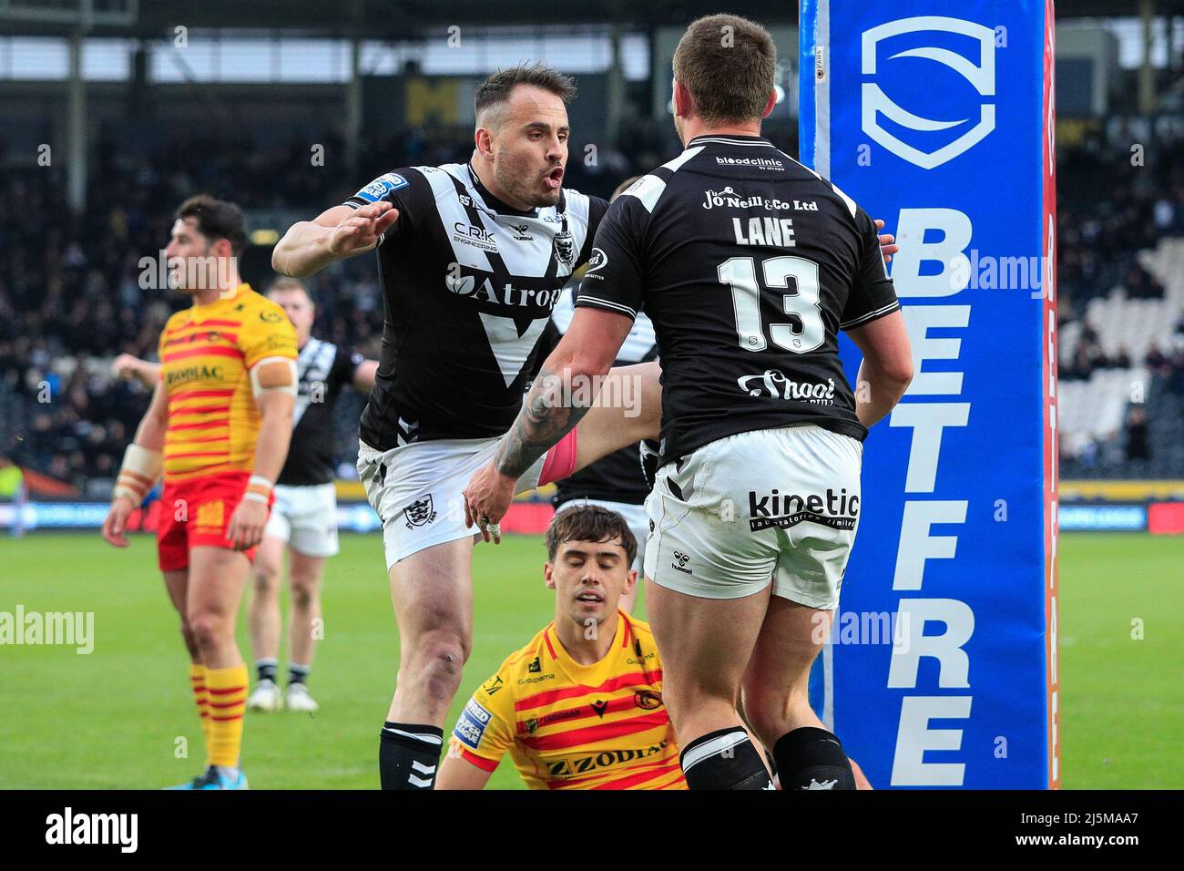 Jordan Lane #13 of Hull FC celebrates his try with Josh Reynolds #6 who ...