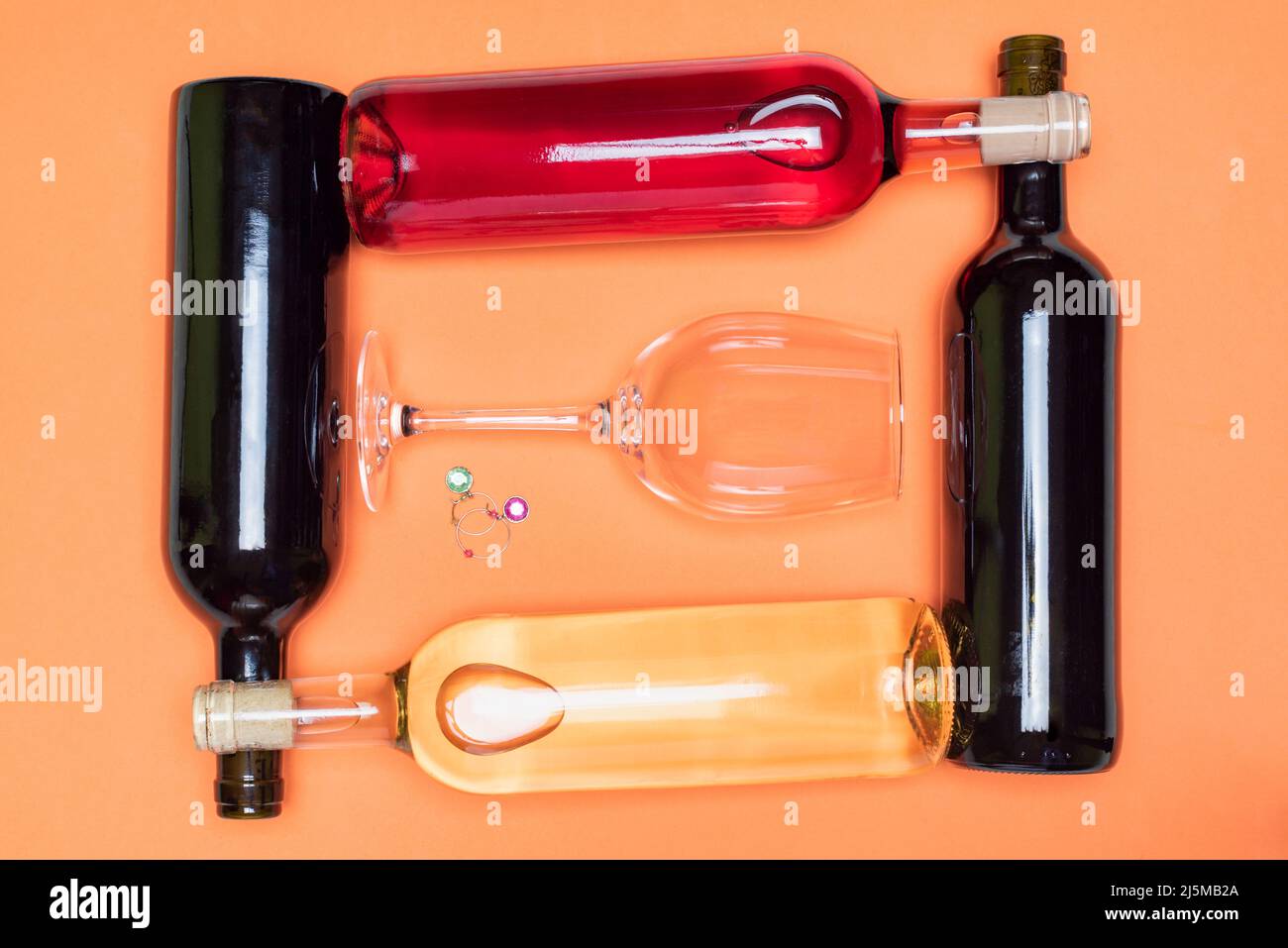 Several Bottles Of Wine Red White And Rosé Placed Horizontally Crossed With Each Other With