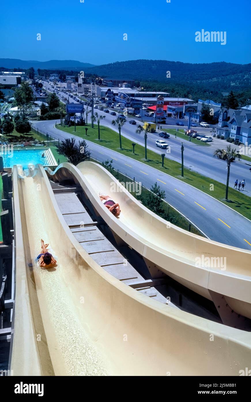 Branson, Missouri USA June 17, 1993: Visitors slide down a giant water ...
