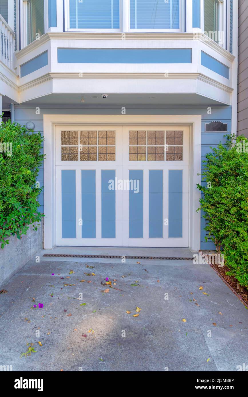 Garage exterior with light blue pallette and white trims at San ...