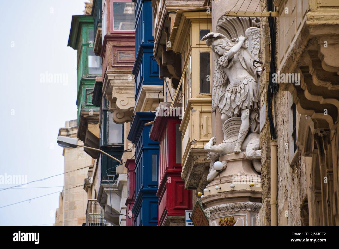 Perspective view of colorful traditional maltese balconies Stock Photo ...