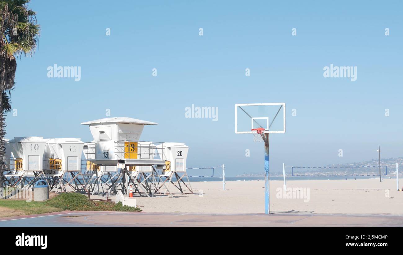 Palm trees and basketball sport field or court on beach, California ...