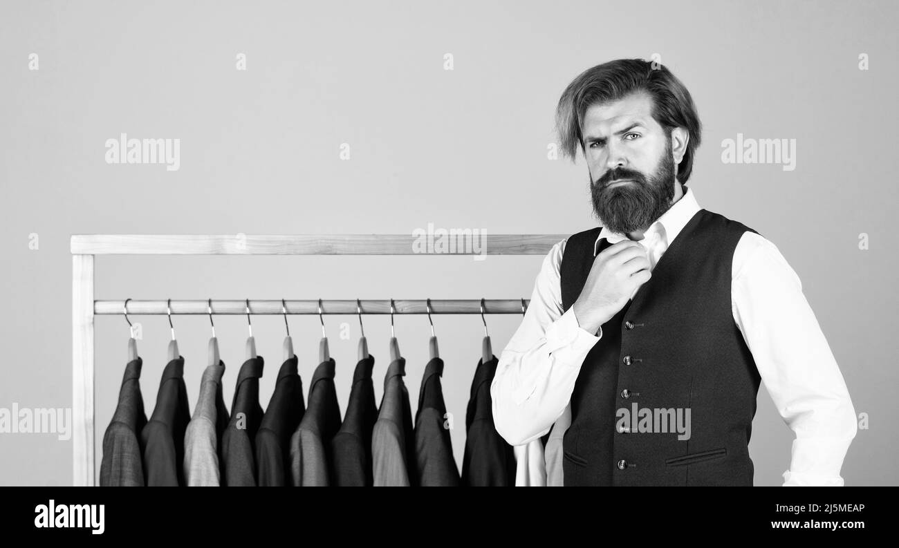 Man picking suit from personal wardrobe, fashion clothes concept Stock ...